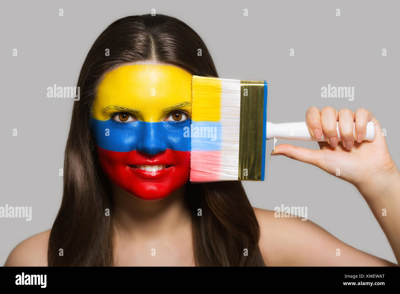 The face of a woman in the national colors of Colombia Stock Photo - Alamy