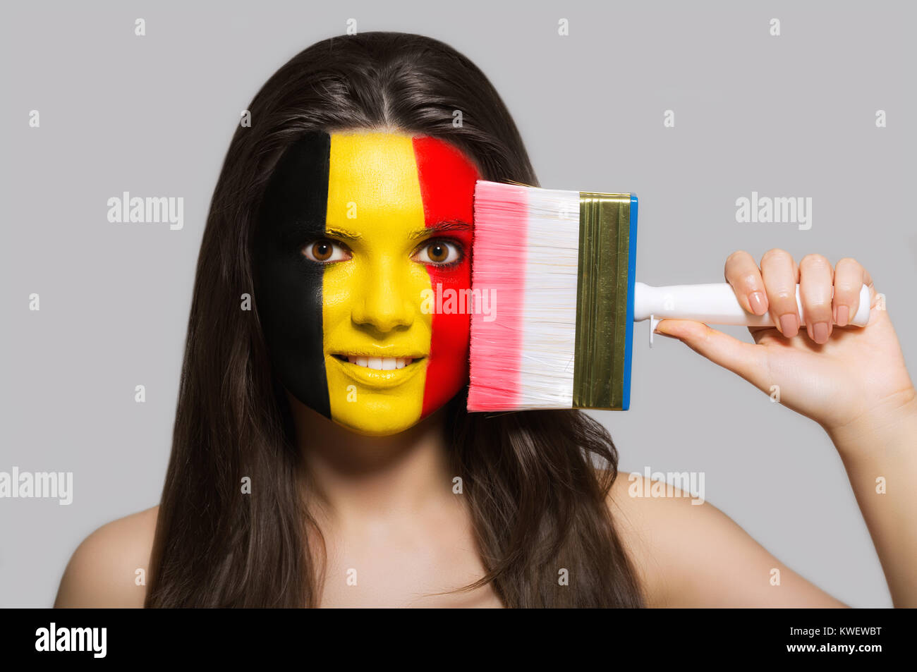 The face of a woman in the national colors of Belgium Stock Photo - Alamy