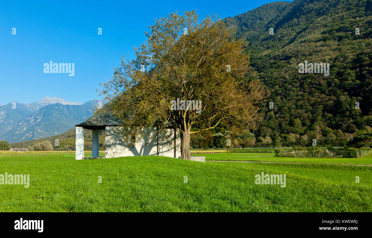 mountain landscape with tree and small church Stock Photo - Alamy