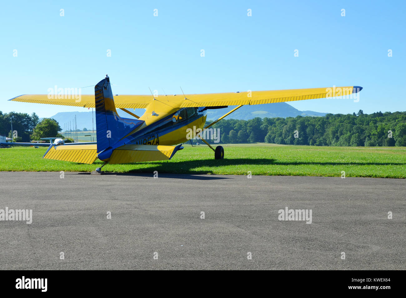 A small yellow plane ready for takeoff, seen at Hahnweide, Stuttgart ...