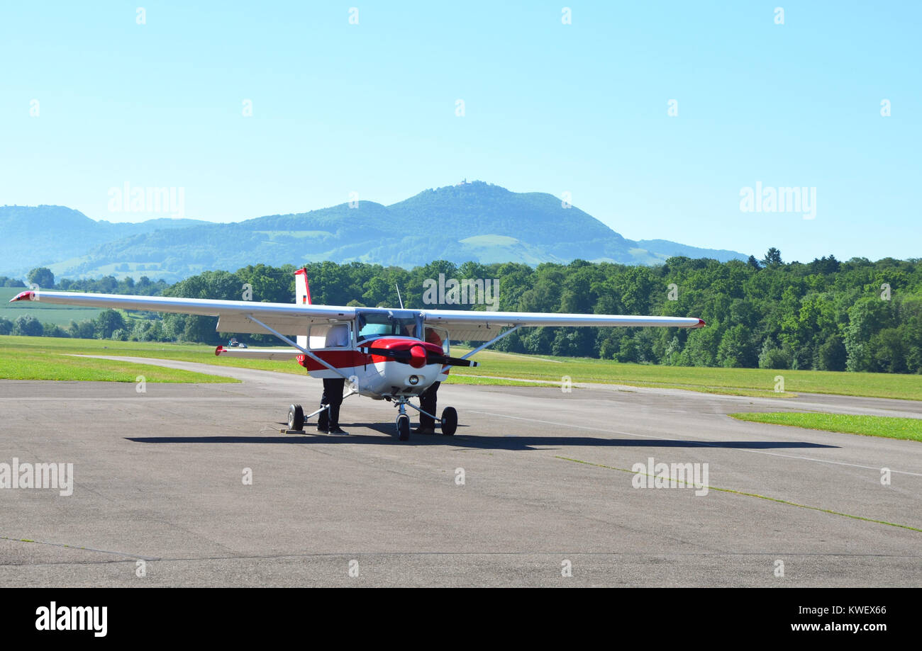 A small yellow plane ready for takeoff, seen at Hahnweide, Stuttgart ...