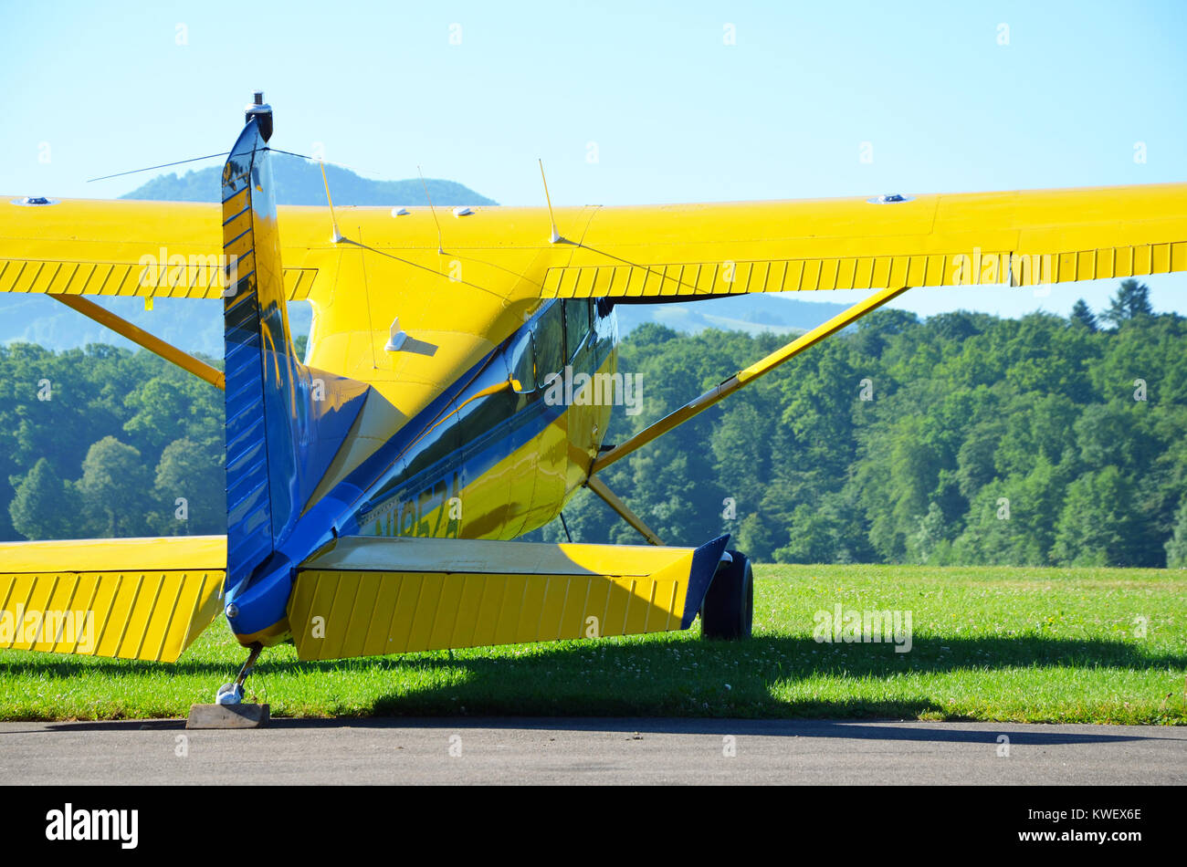 A small yellow plane ready for takeoff, seen at Hahnweide, Stuttgart ...