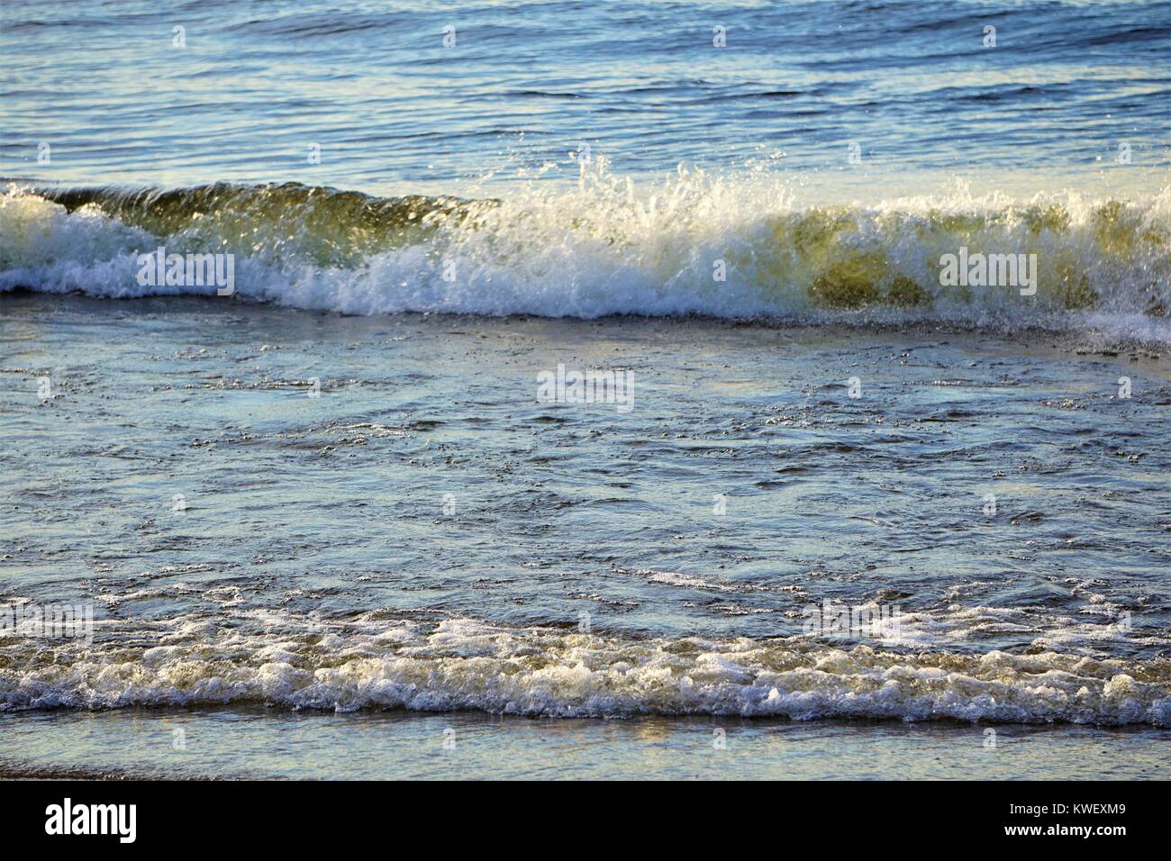 Waves at the Beach in Autumn Stock Photo - Alamy