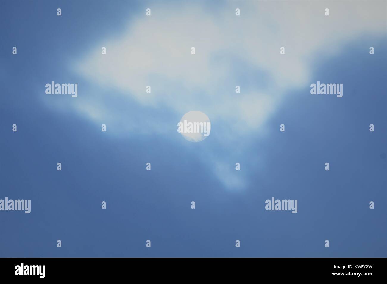 Sun Behind Heavy Clouds Stock Photo - Alamy