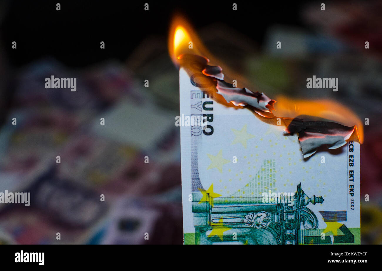 A hundred euro bill in Europe currency is on fire Stock Photo - Alamy