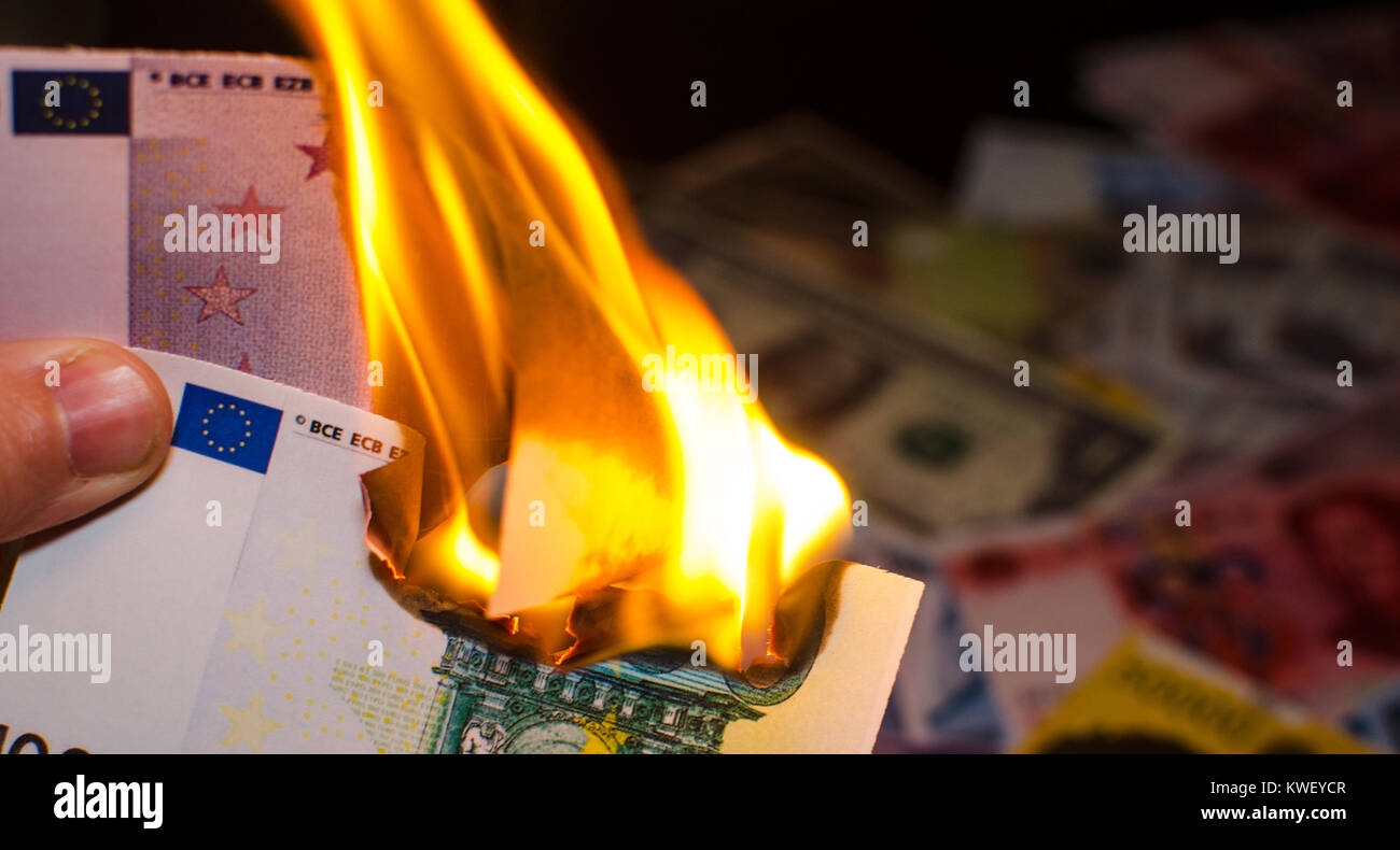 A hundred euro bill in Europe currency is on fire Stock Photo - Alamy