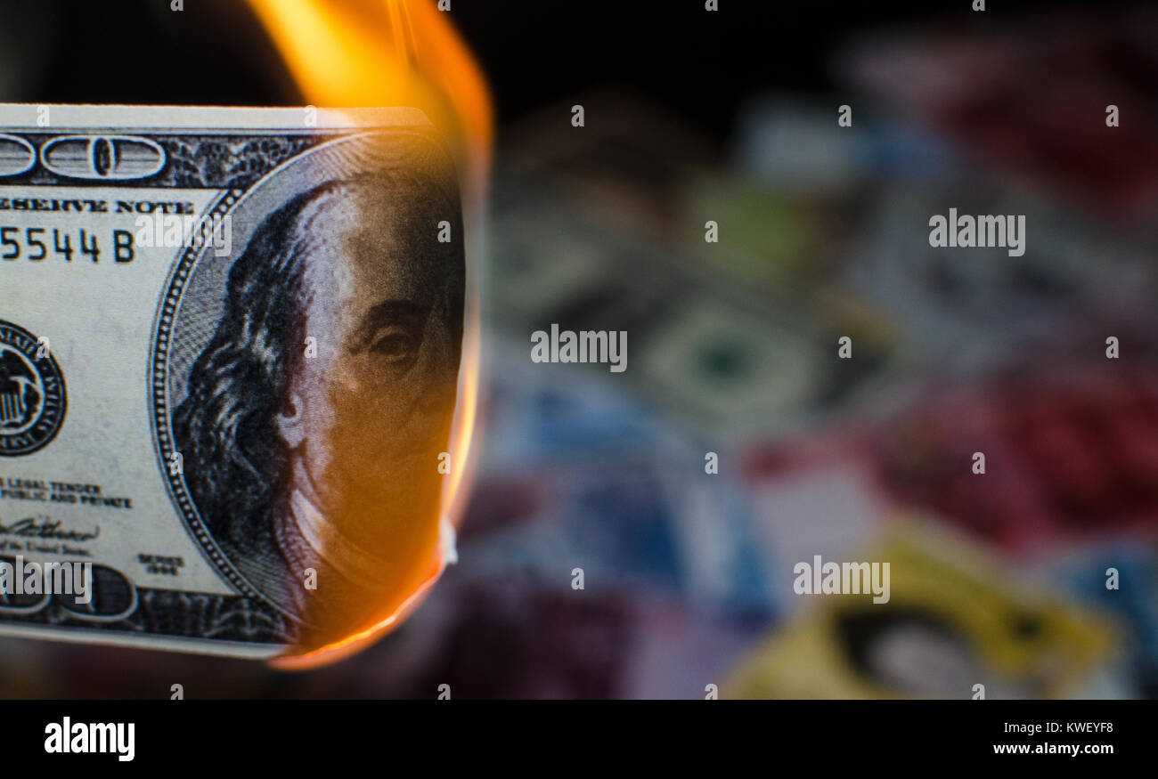 A hundred dollar bill in American US currency is on fire Stock Photo ...