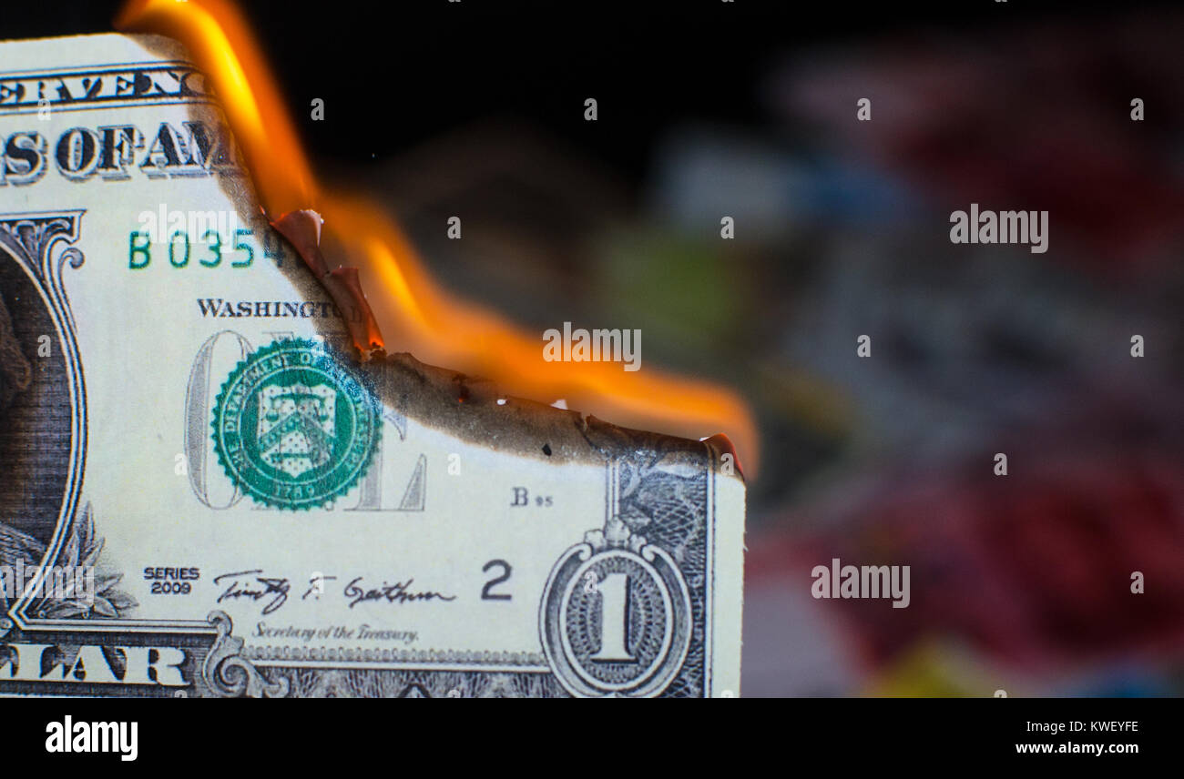 A one dollar bill in American US currency is on fire Stock Photo - Alamy