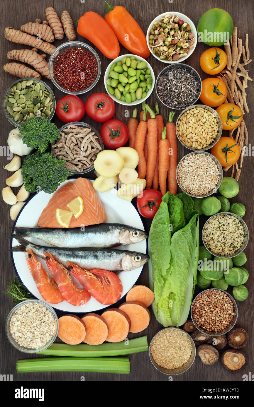 Health food concept with fresh seafood, vegetables, fruit, seeds ...