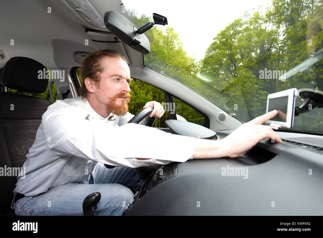 Driver using GPS navigation a way Stock Photo - Alamy