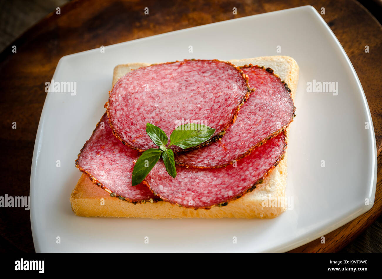 Toast with italian salami Stock Photo - Alamy