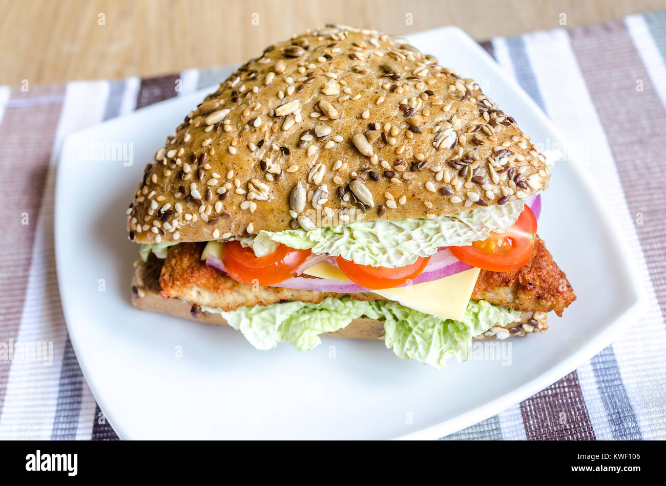 Triangle wholewheat-bun hamburger Stock Photo - Alamy