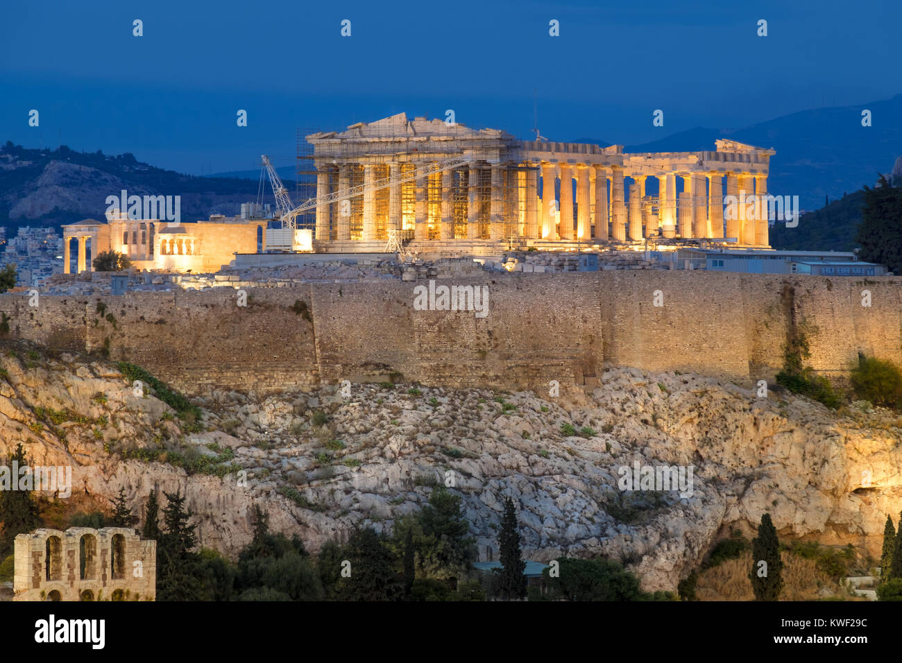 Parthenon and Herodium construction in Acropolis Hill in Athens, Greece, illuminated in the ...