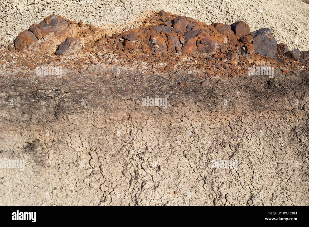 Red ironstone layer in bentonite clay in Alberta badlands, Drumheller ...