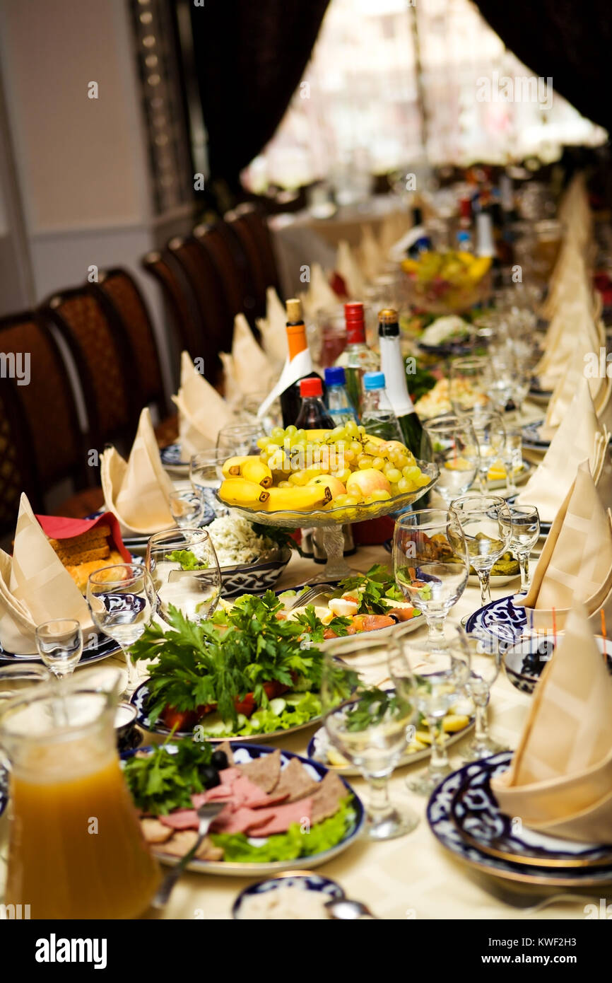 Restaurant table with snacks and beverages on it Stock Photo - Alamy