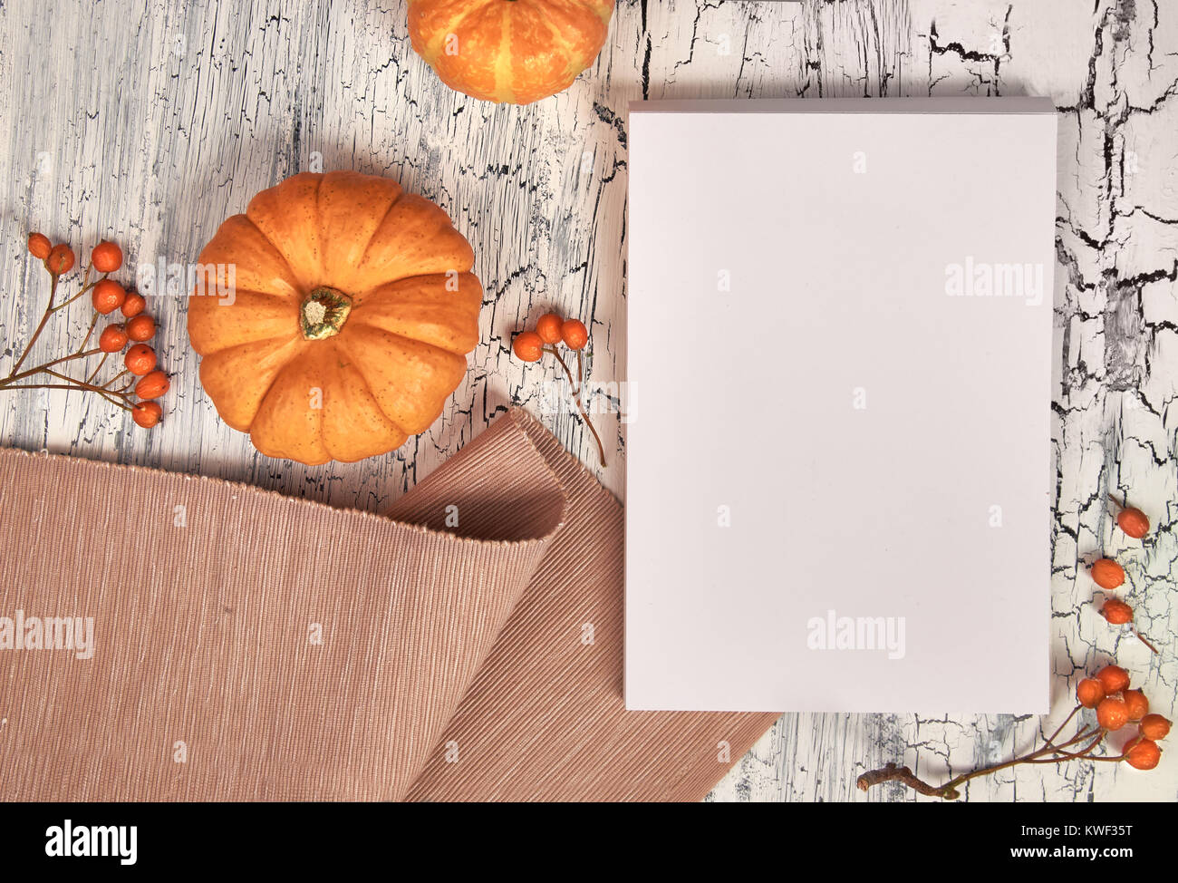 Paper mockup for your artwork or text. Autumn decorations: pumpkins ...