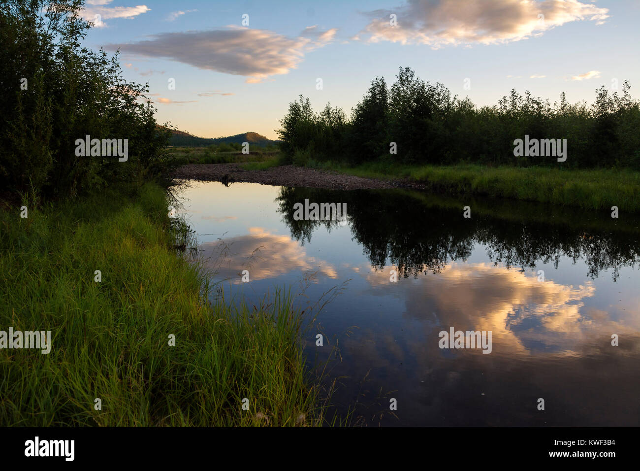 Beautiful Sunset Landscape with reflection on River Sky and Clouds ...