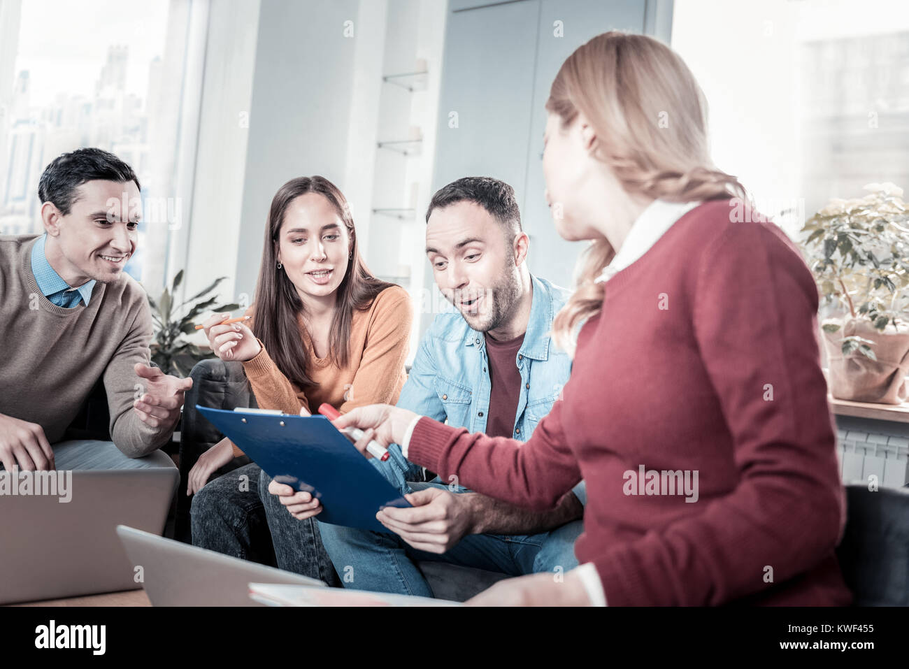 Interesting detail. Four young interested clever people working in the ...