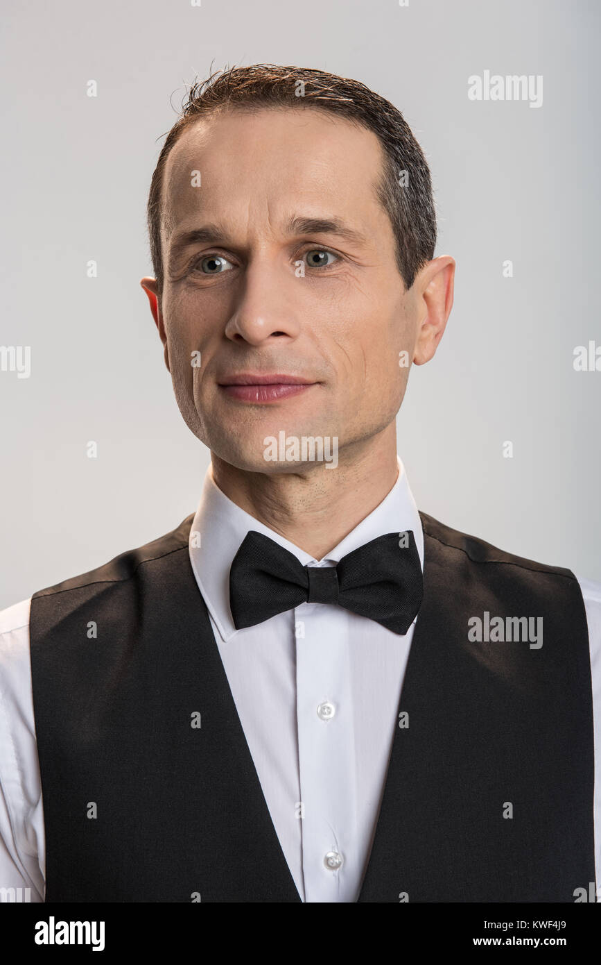 Irresistible calmness. Serious pensive good looking man gazing aside ...