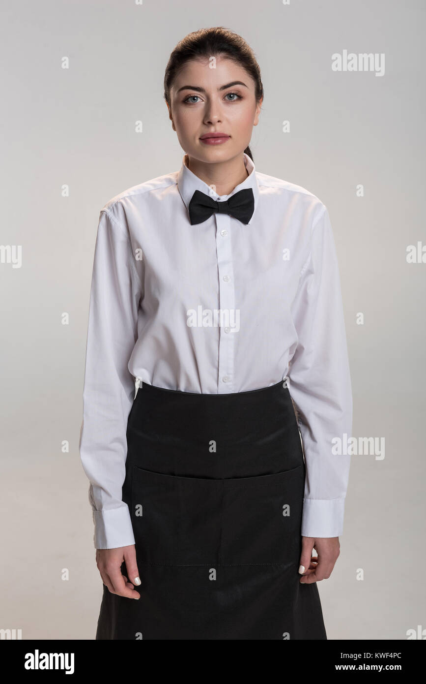 Work in restaurant. Attractive confident nice waitress standing while ...