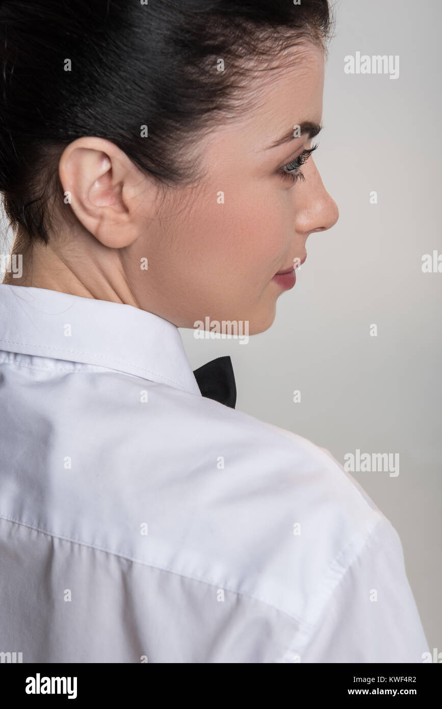 Last goodbye. Charming attractive good looking woman turning head in ...