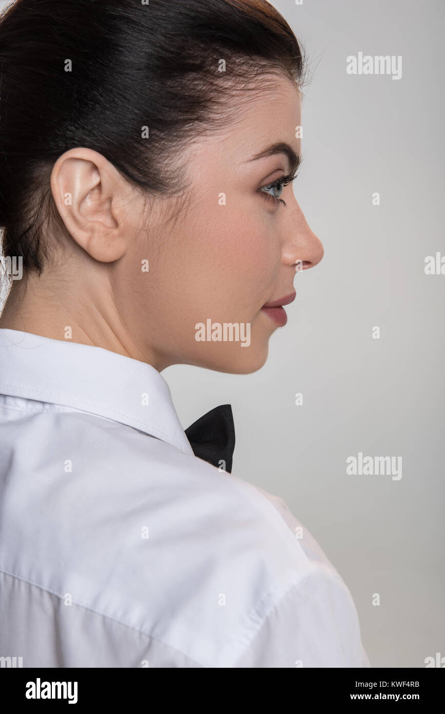 Pensive mood. Appealing kind brunette woman posing on the isolated ...