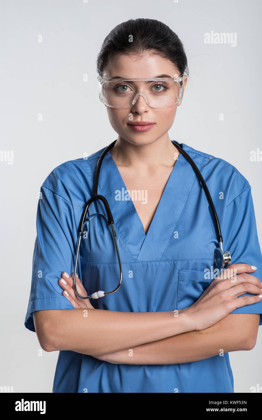 Right Decision Beautiful Brunette Female Doctor Standing On The Grey