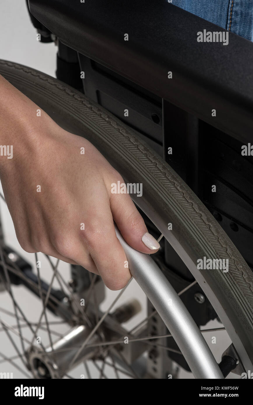 Never stop. Young smooth hand of disabled woman running wheel of the ...