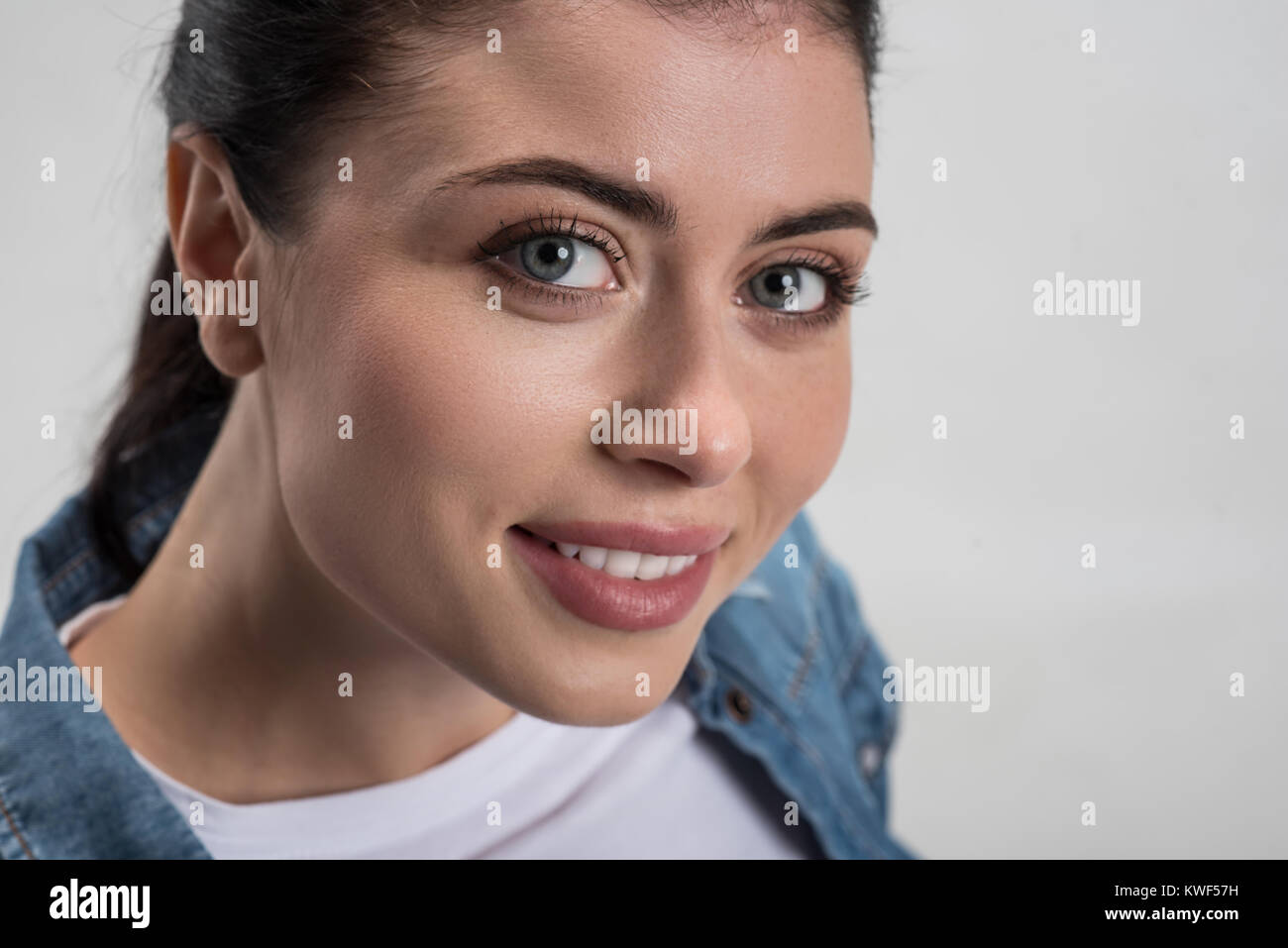 Sincere feelings. Close up of charming jolly optimistic woman standing ...