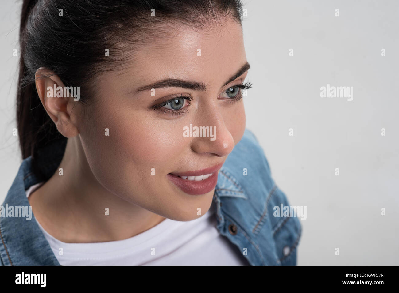 Calm look. Happy joyful appealing woman smiling against isolated ...