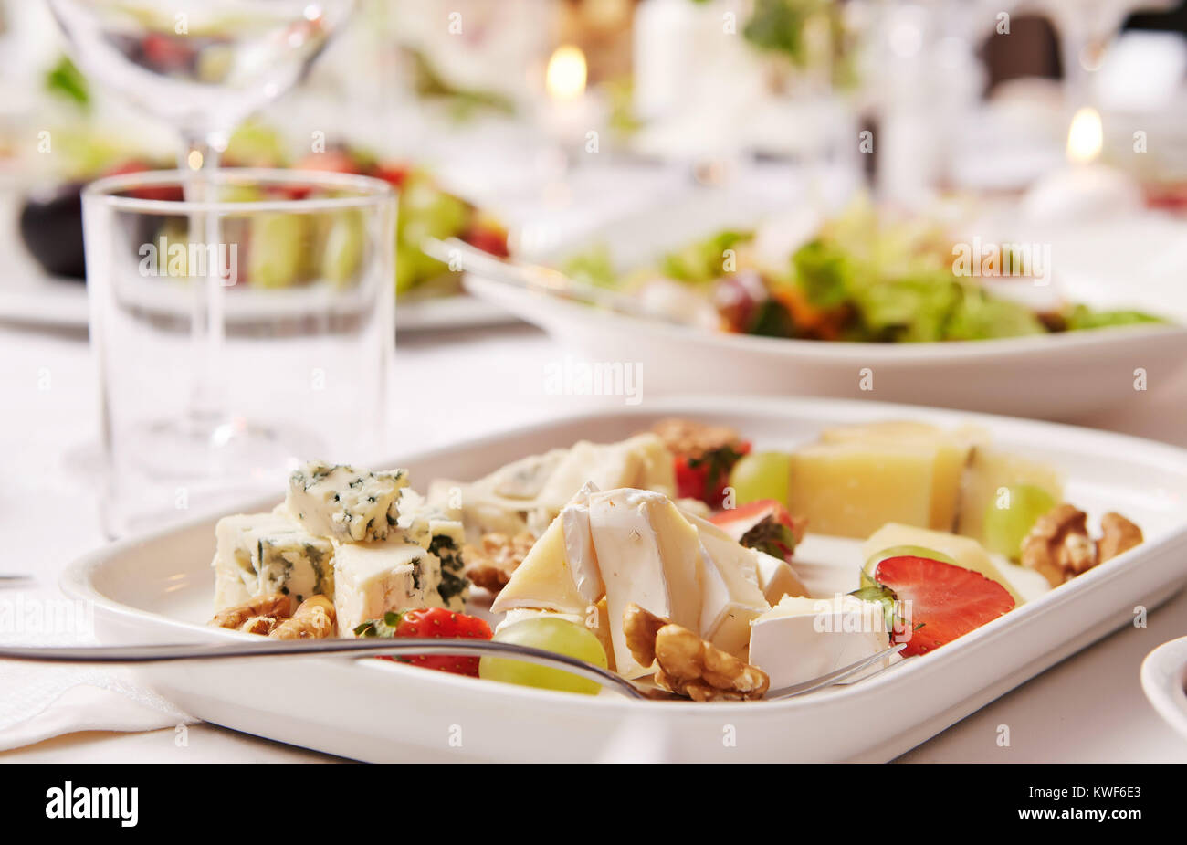 Served table with different meals Stock Photo - Alamy