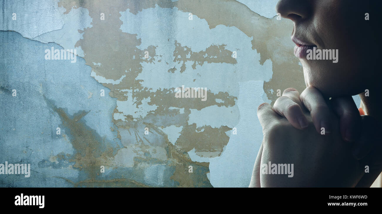 Composite image of woman praying over white background Stock Photo - Alamy