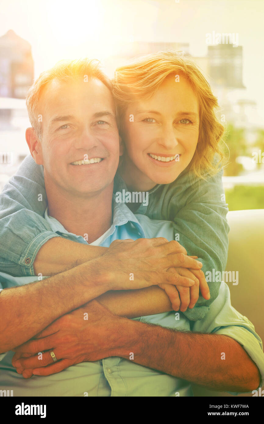 Portrait of happy woman hugging her husband Stock Photo - Alamy