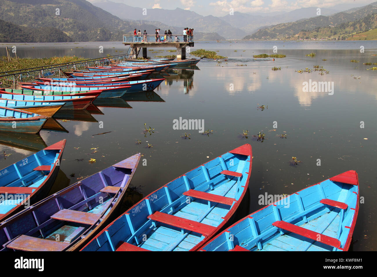 Pier and boats on the Phewa lake in Nepal Stock Photo - Alamy