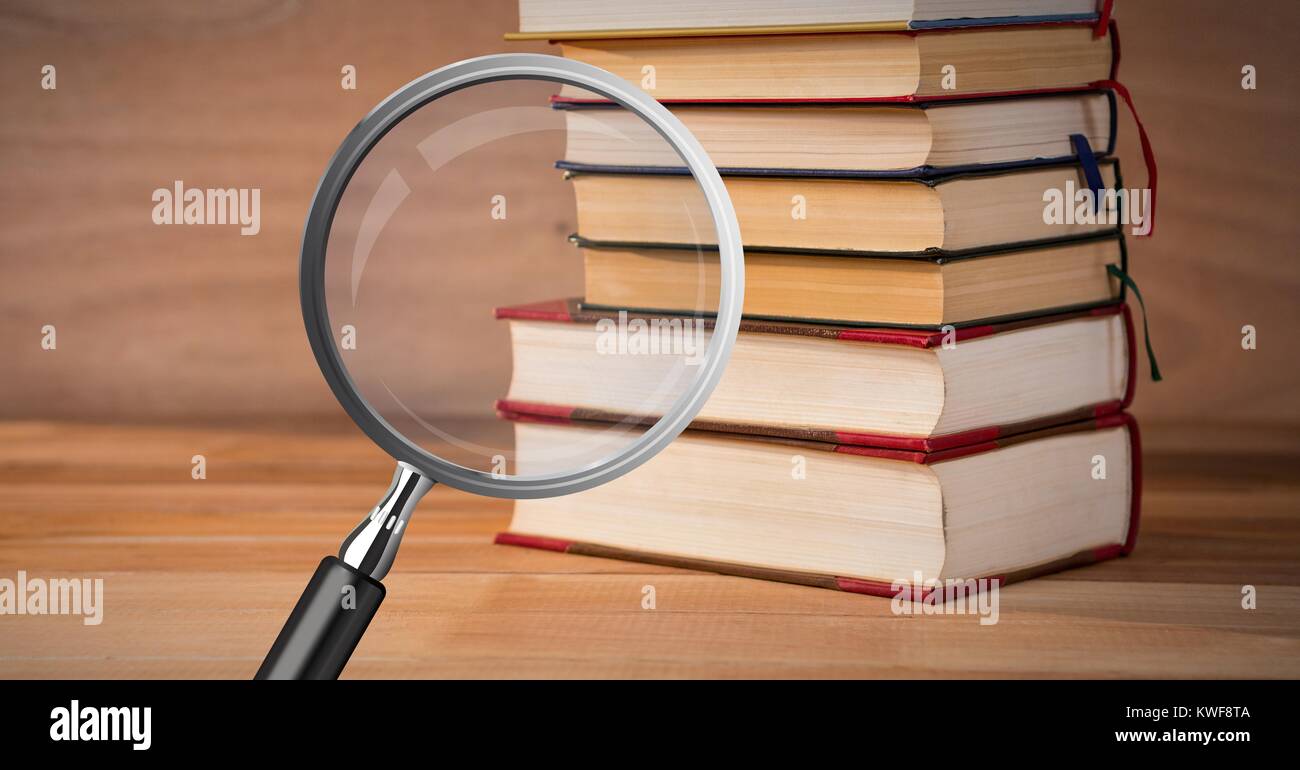 3D Magnifying glass over books Stock Photo - Alamy