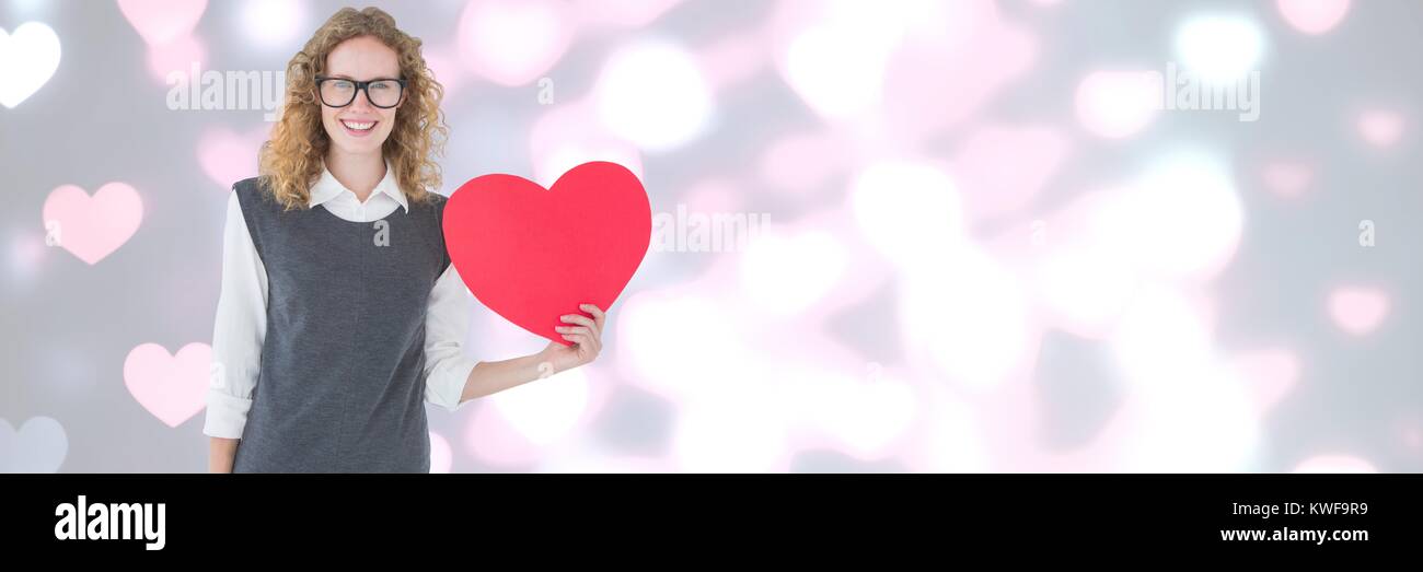 Valentines lady holding heart with love hearts background Stock Photo ...