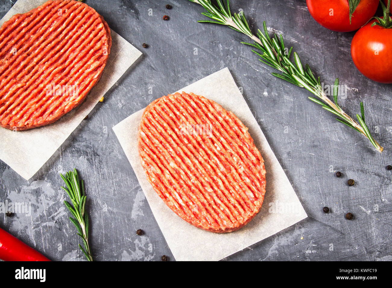 Raw burgers on parchment hi-res stock photography and images - Alamy