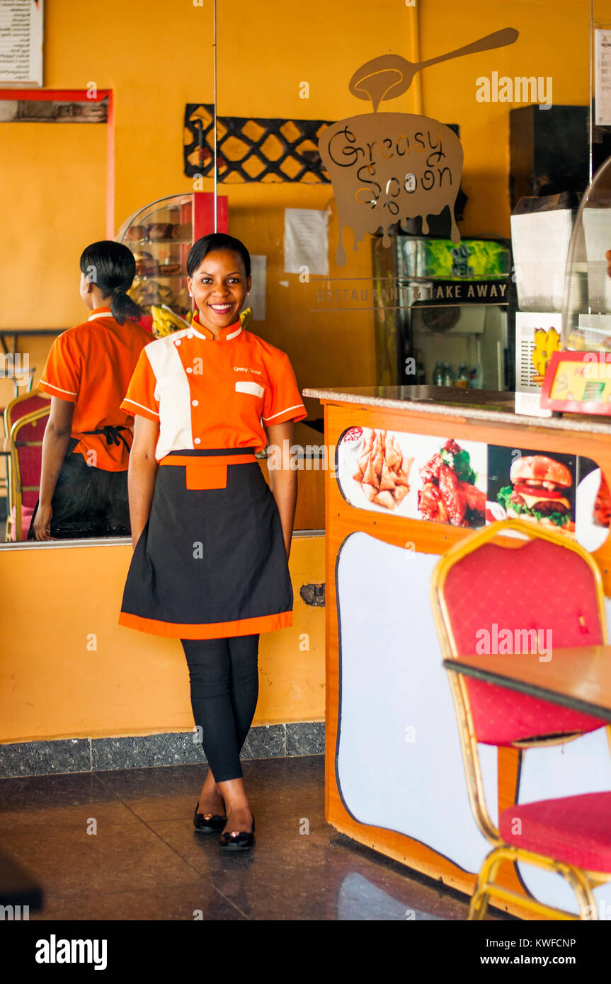 Waitress in fast food outlet, Kampala Road, Kampala, Uganda Stock Photo ...