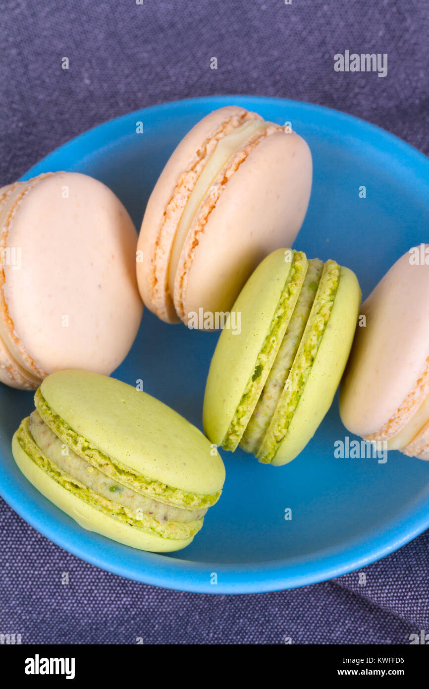 Detailed view of colorful tasty and yummy macarons served in plate ...
