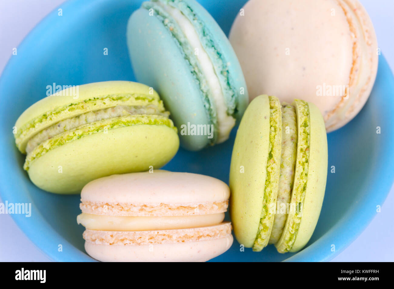 Detailed view of colorful tasty and yummy macarons served in plate ...
