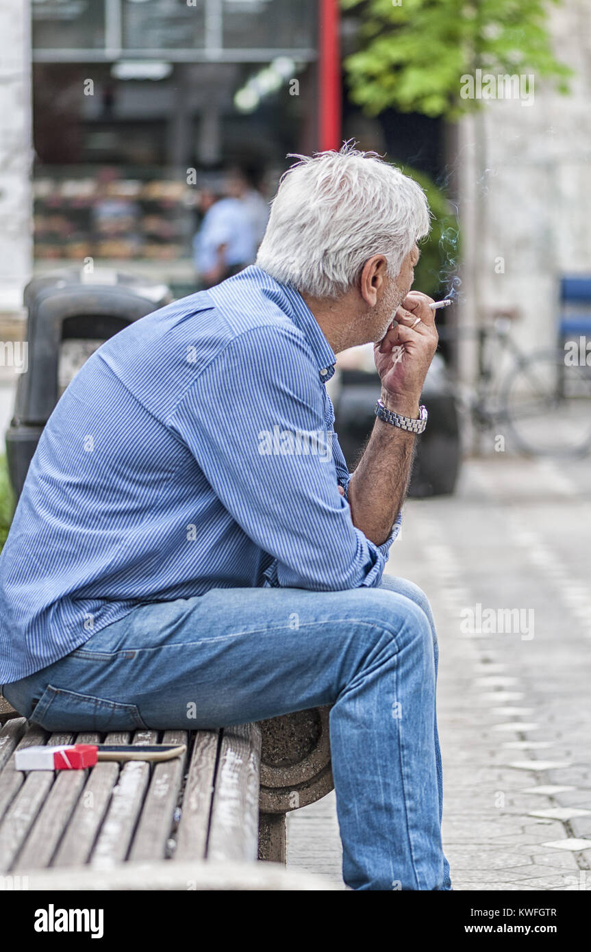 Elder Man Sitting On A Bench High Resolution Stock Photography and ...