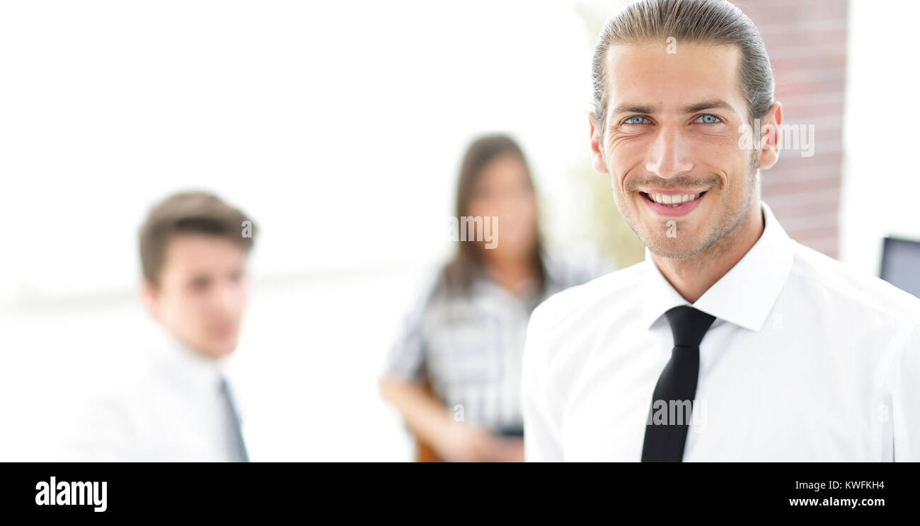 successful young business men on blurred background Stock Photo - Alamy