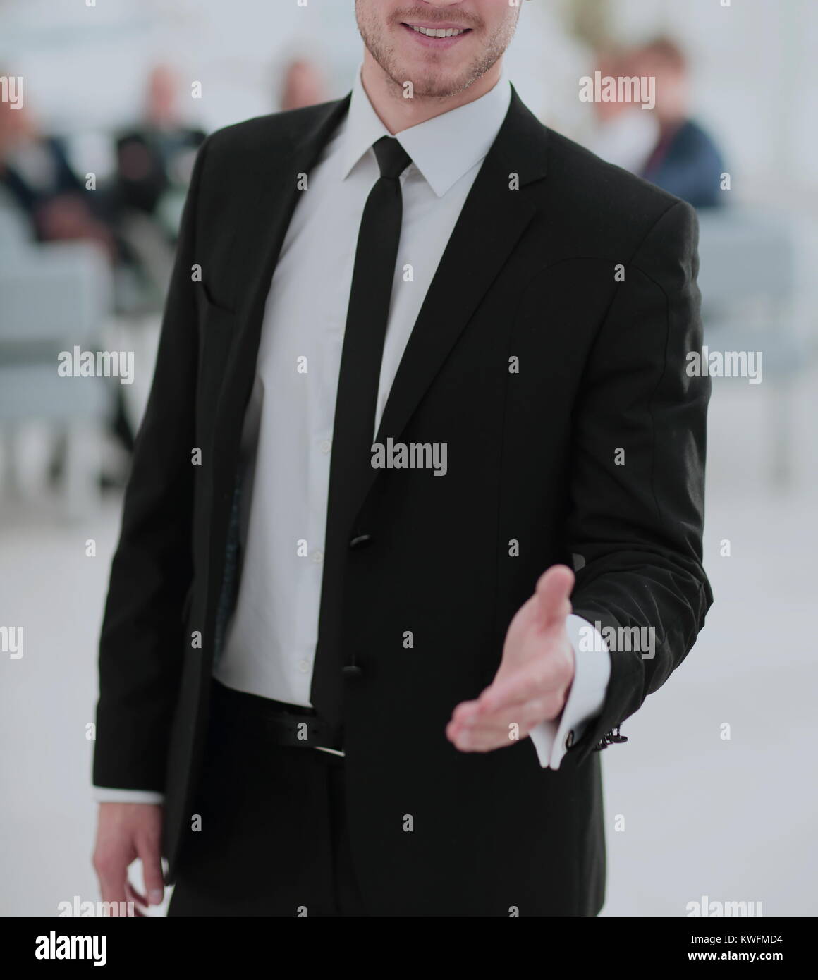 Portrait of a young handsome businessman offering a handshake Stock ...