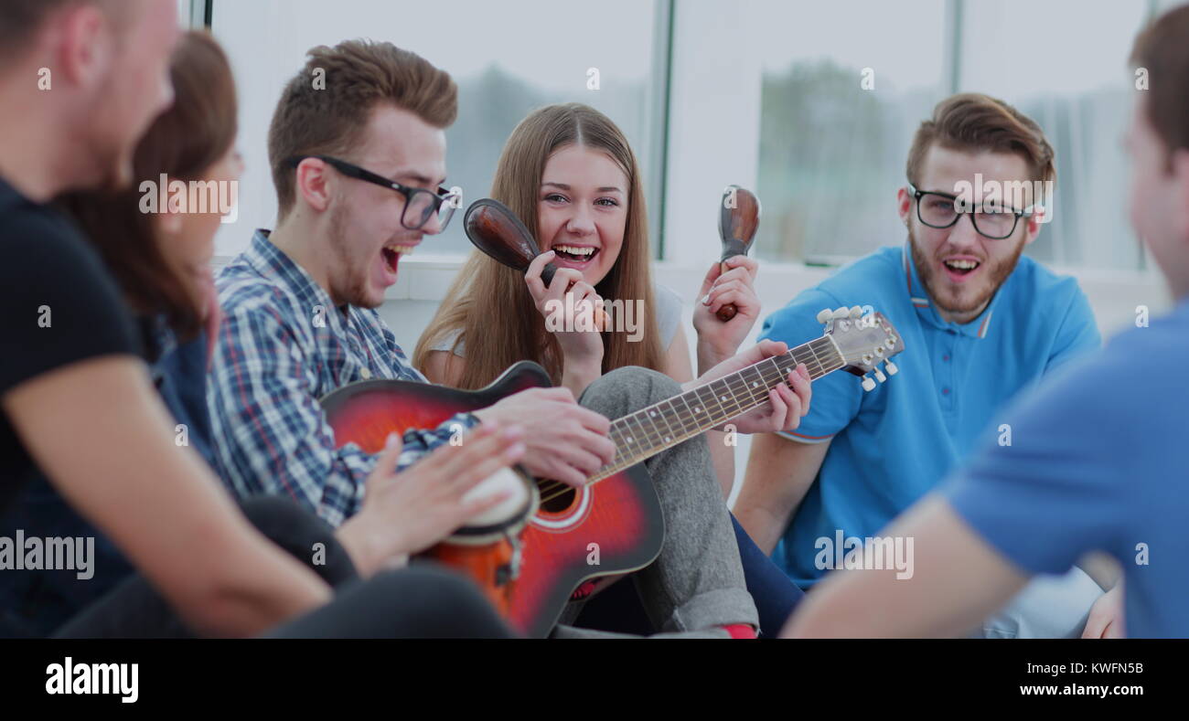 Happy young people having fun and playing different musical inst Stock ...