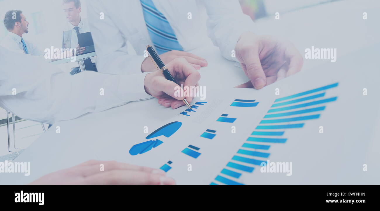 Close-up of business people working with documentation Stock Photo - Alamy