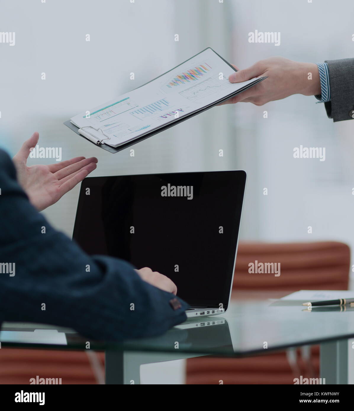 Businessman his colleague giving contract to read and sign Stock Photo ...