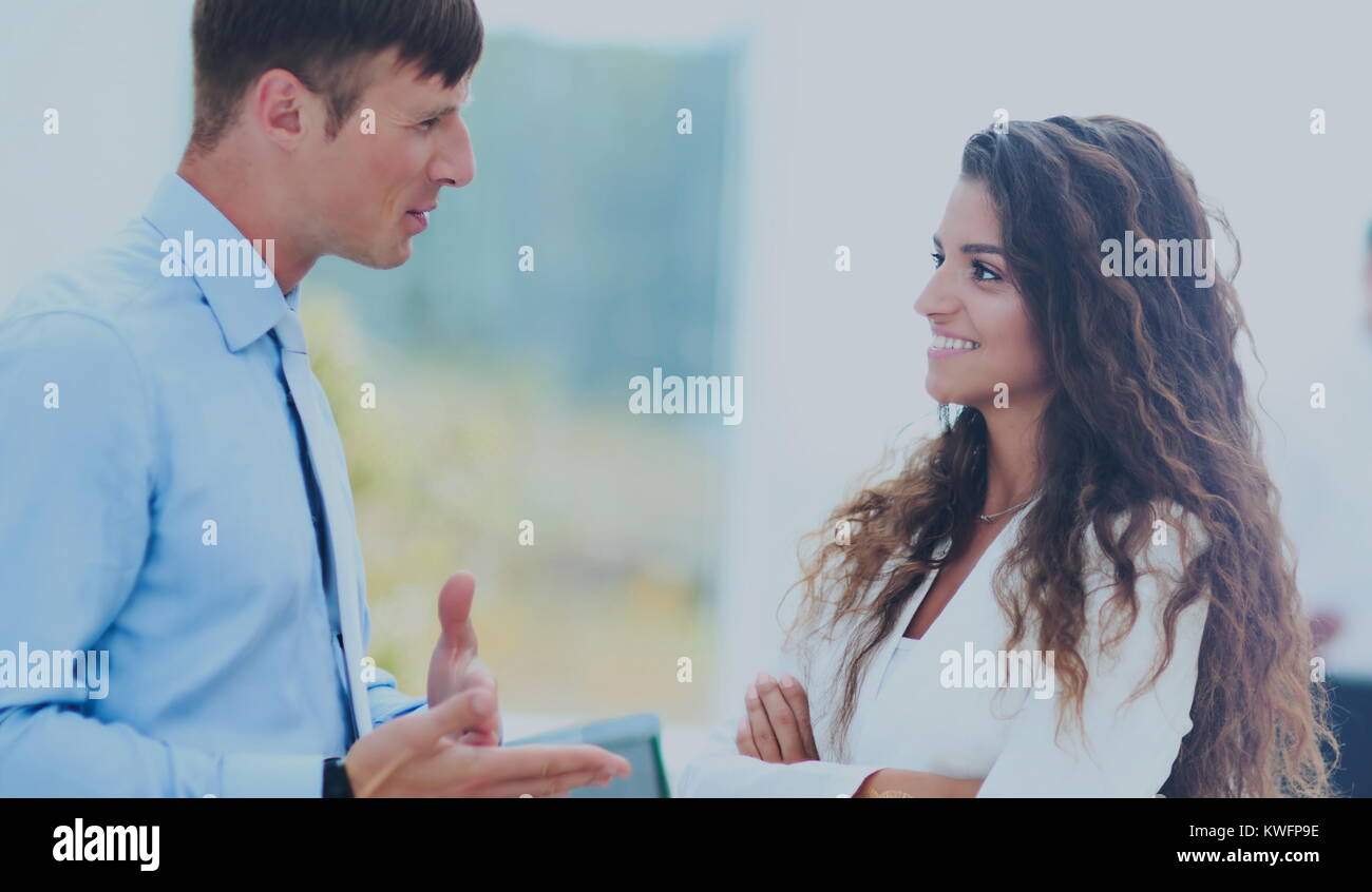 Business - meeting in office, two managers are discussing a docu Stock ...