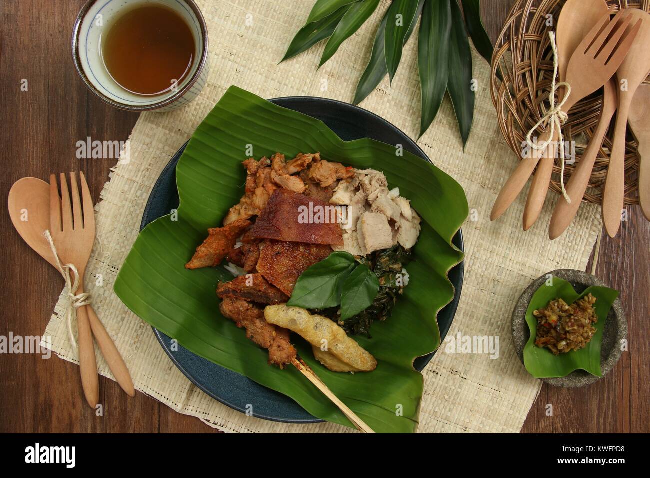 Nasi Campur Babi Guling. Balinese rice dish of steamed rice topped with ...