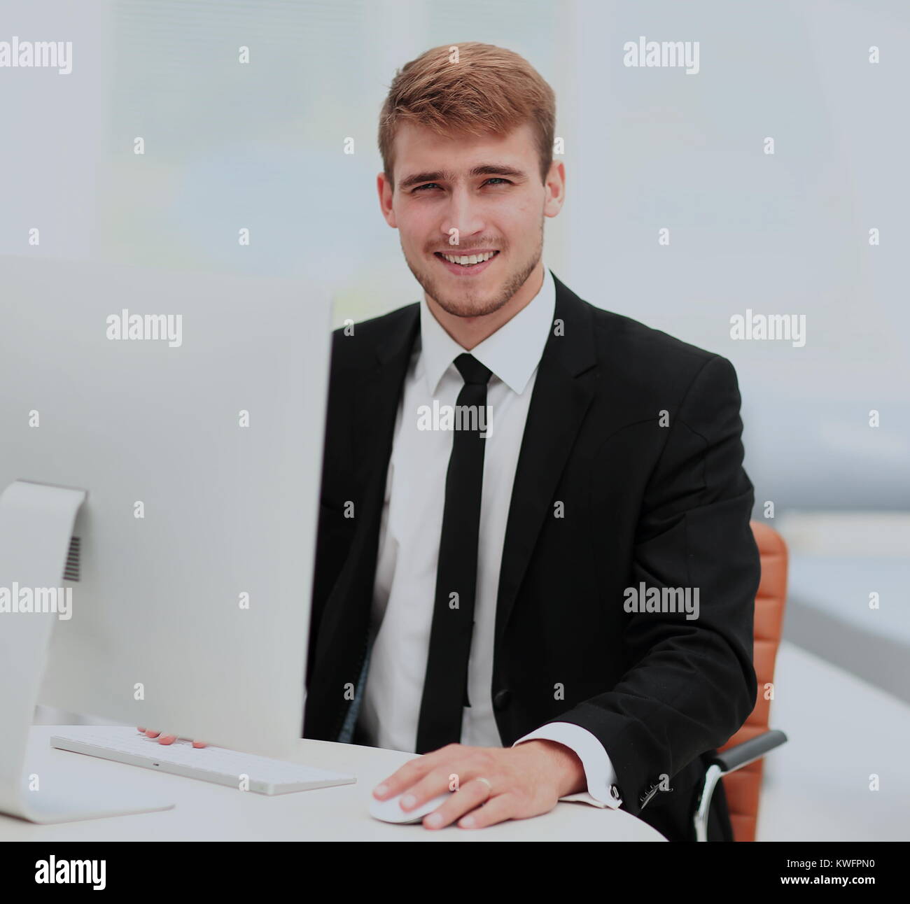 Portrait of happy businessman at the workplace Stock Photo - Alamy