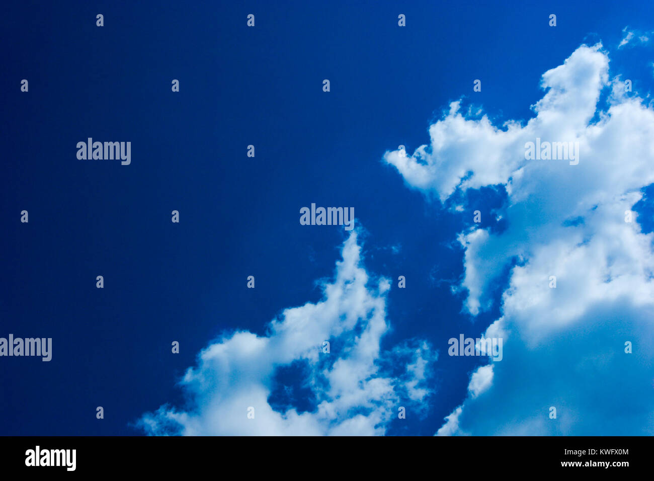 Deep blue bright sky with clouds Stock Photo - Alamy